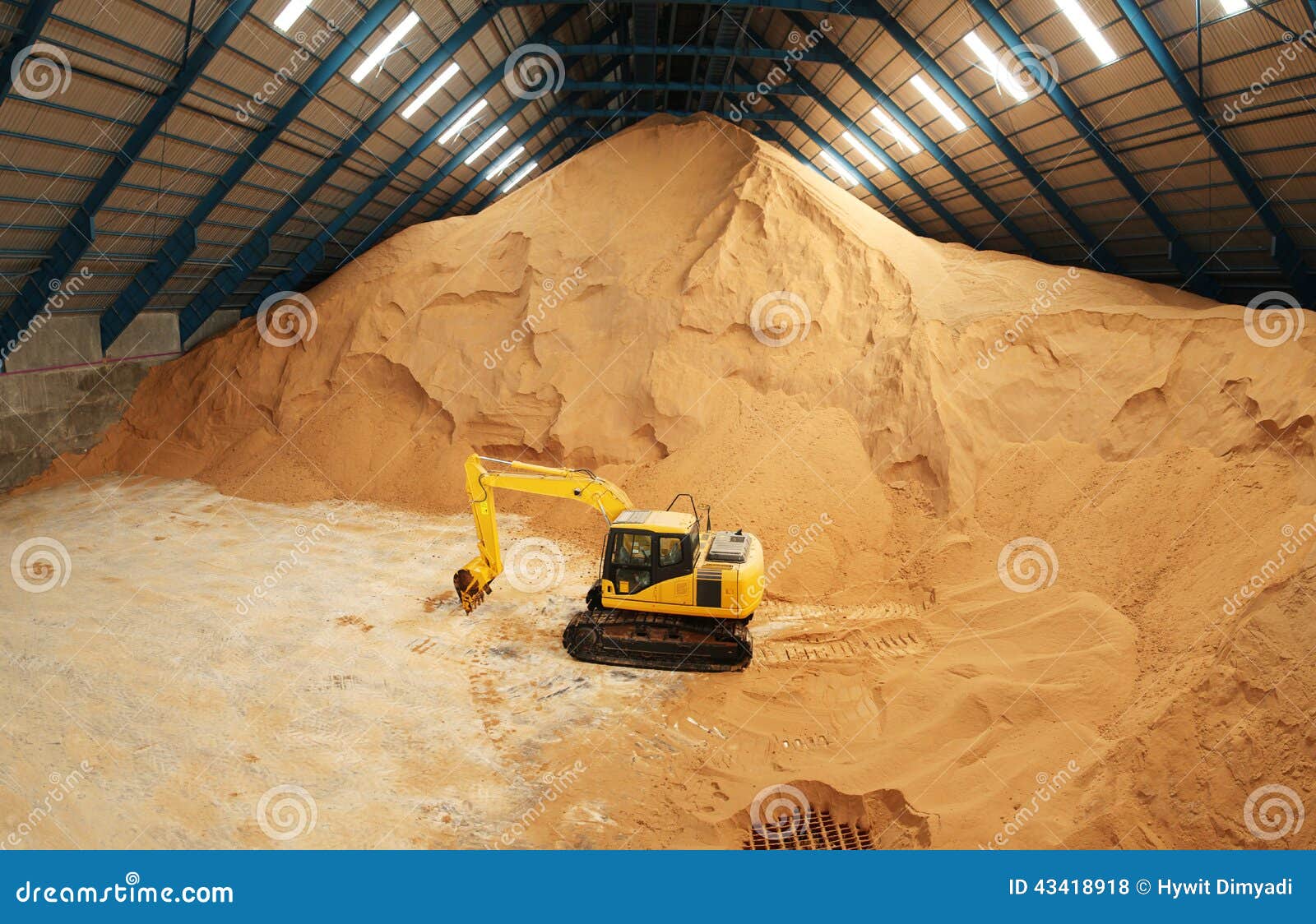 Excavator in a Raw Sugar Storage Stock Photo - Image of golden ...