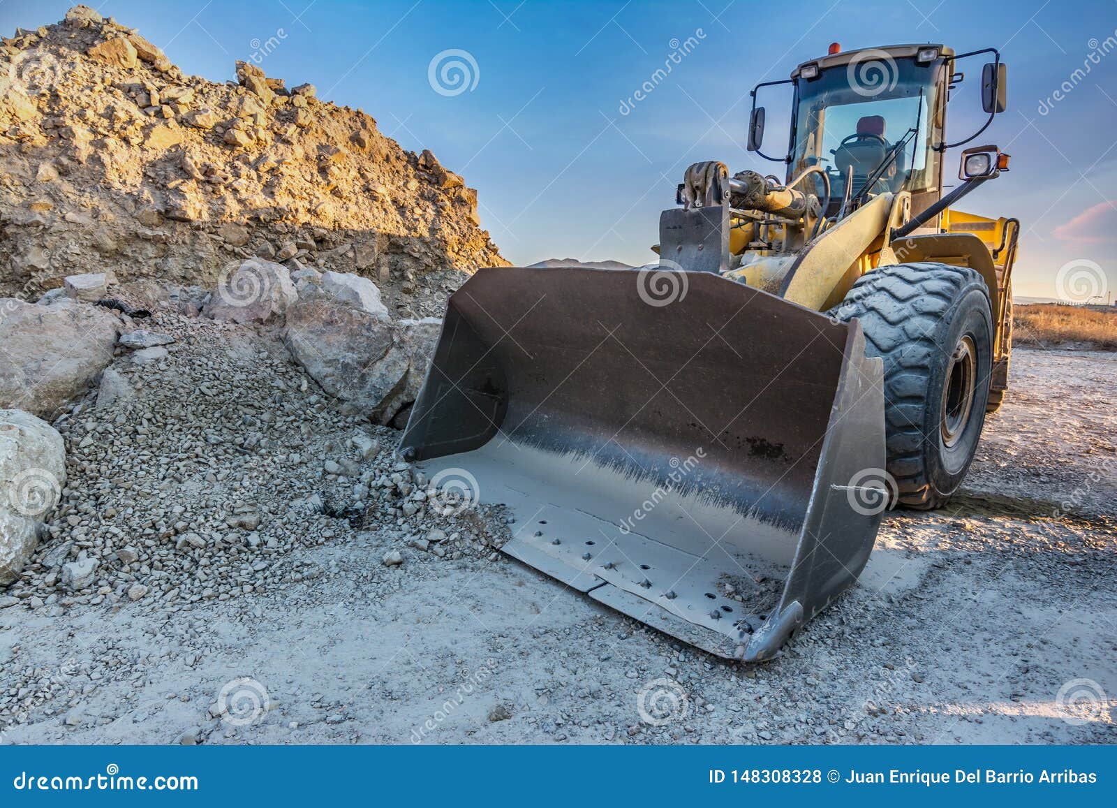 Excavator Removing Stone in the Construction Works of a Road Stock ...