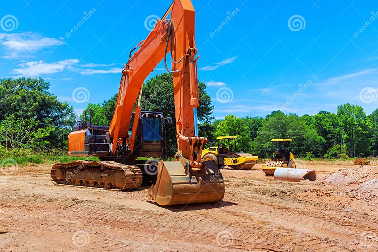 Excavator Road Roller Working on Sunny Day at a Construction Site ...