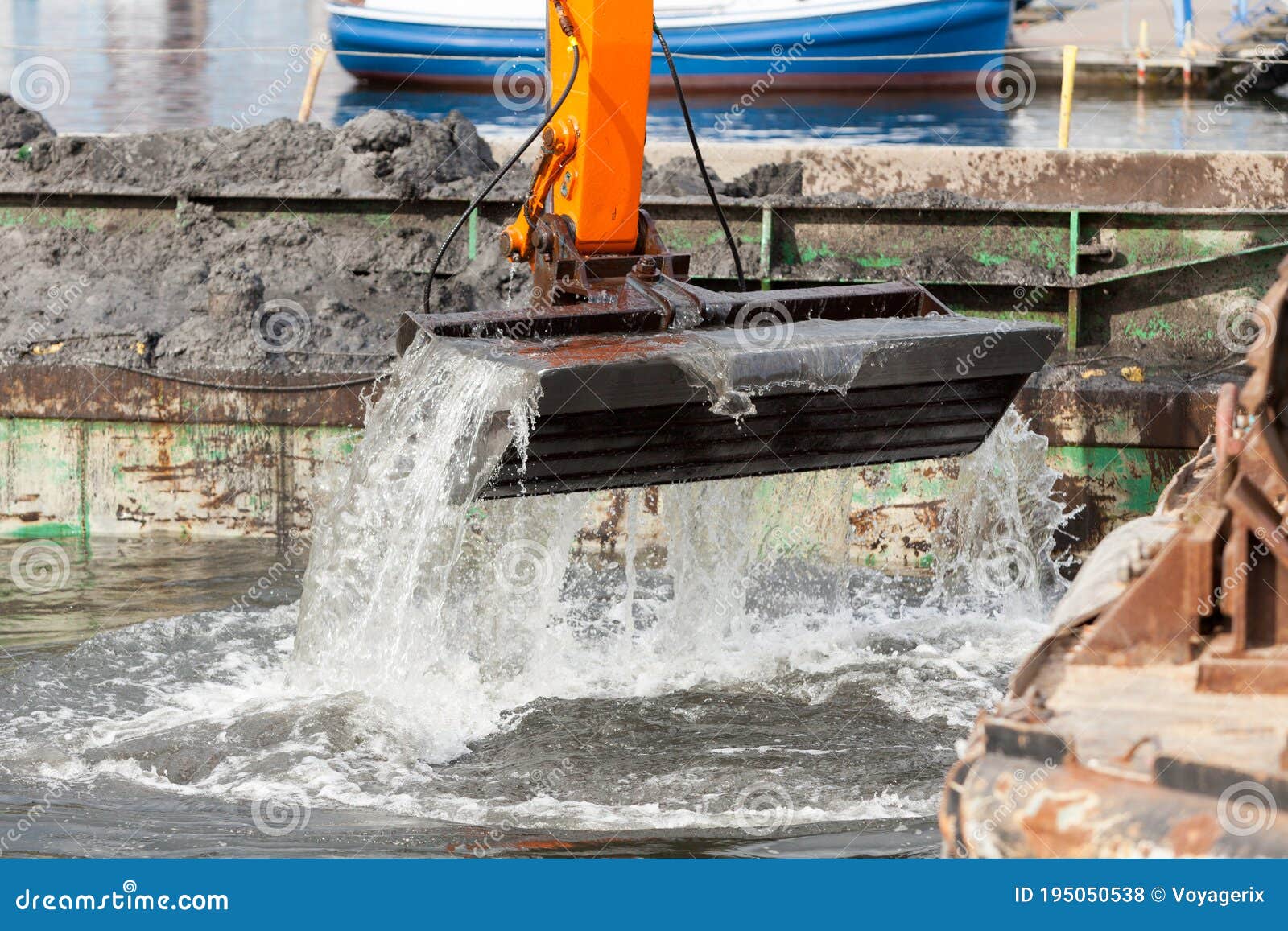 Excavator Shovel Digging in Sand from Water Stock Photo - Image of ...