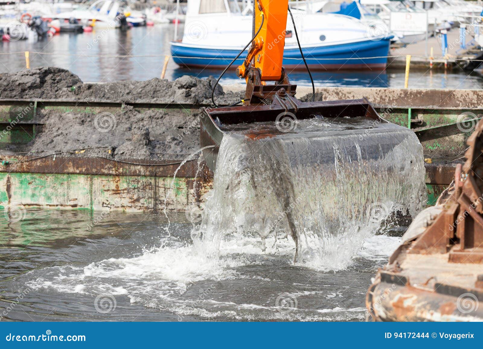 Excavator Shovel Digging in Sand from Water Stock Photo - Image of ...