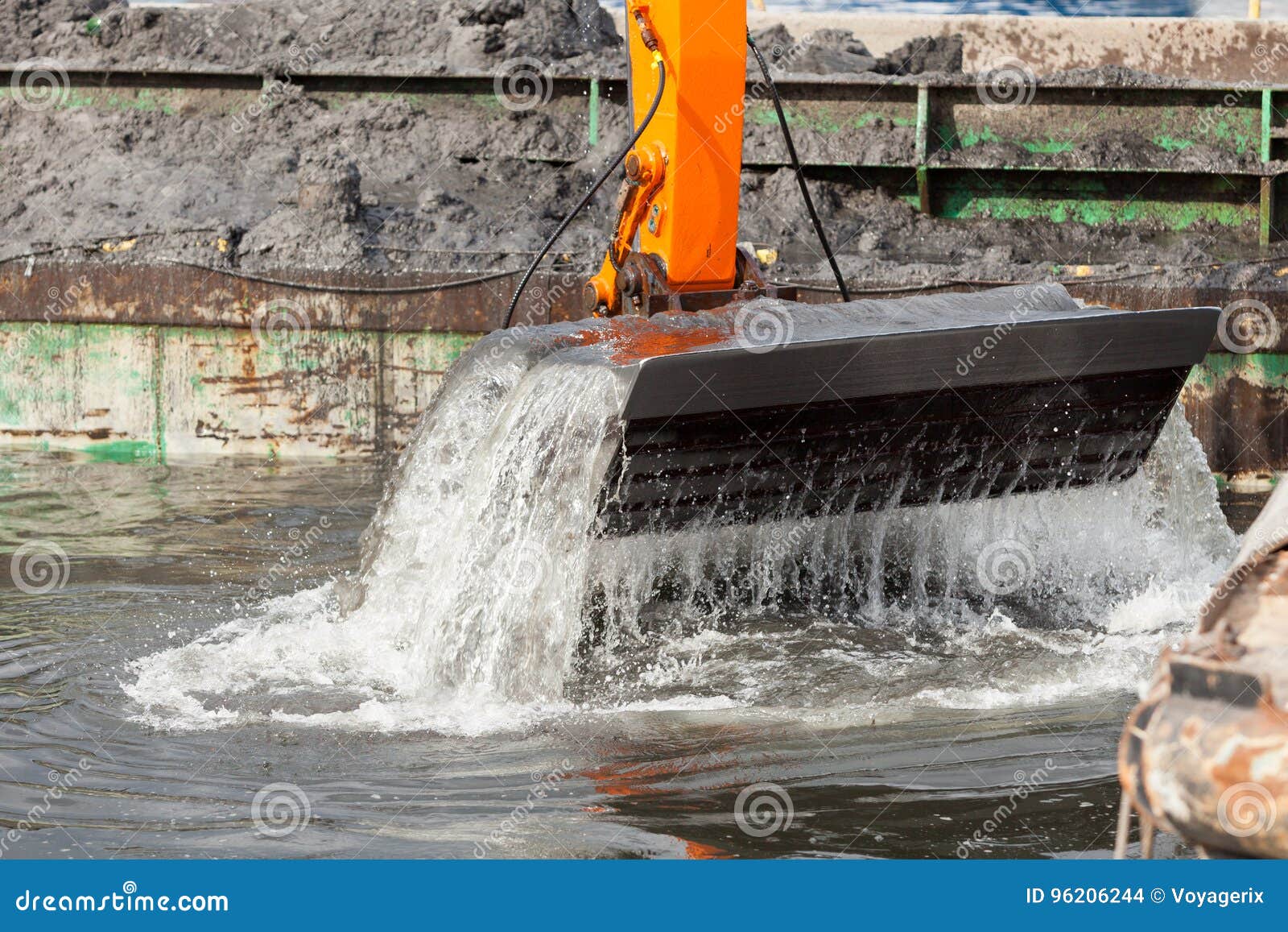 Excavator Shovel Digging in Sand from Water Stock Photo - Image of ...