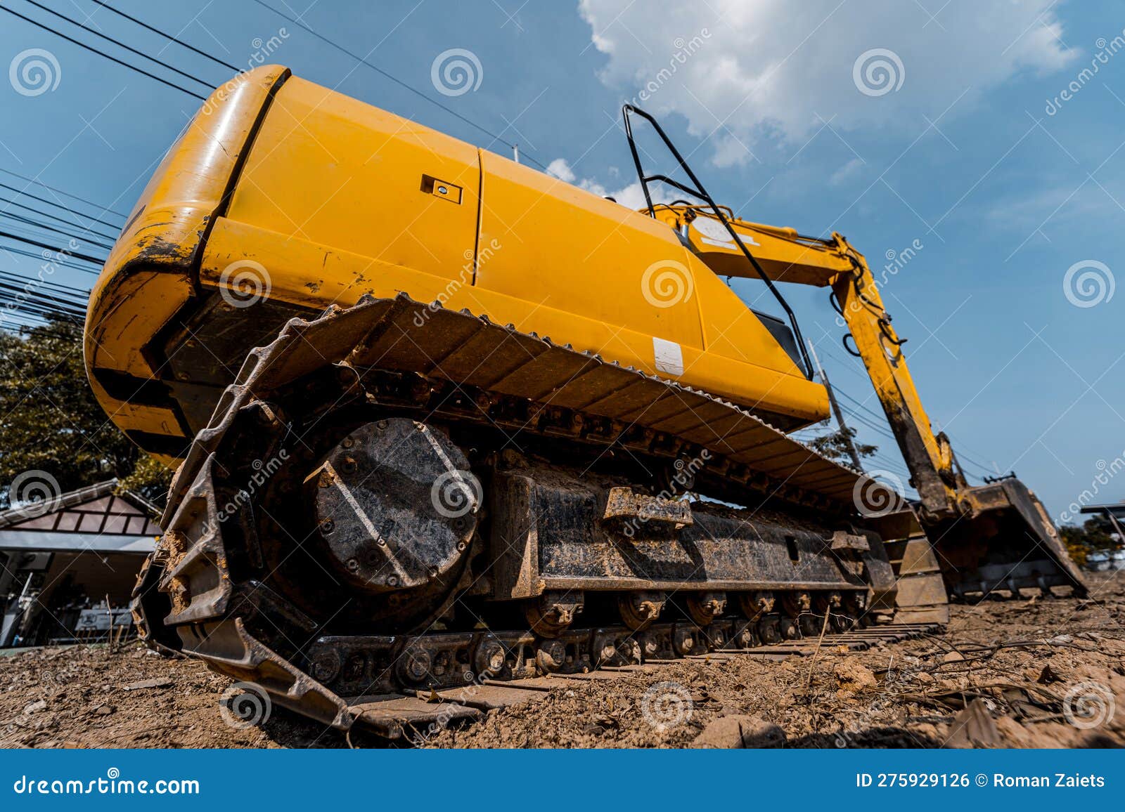 Excavator with Shovel Digs the Ground for the Foundation at Constuction ...