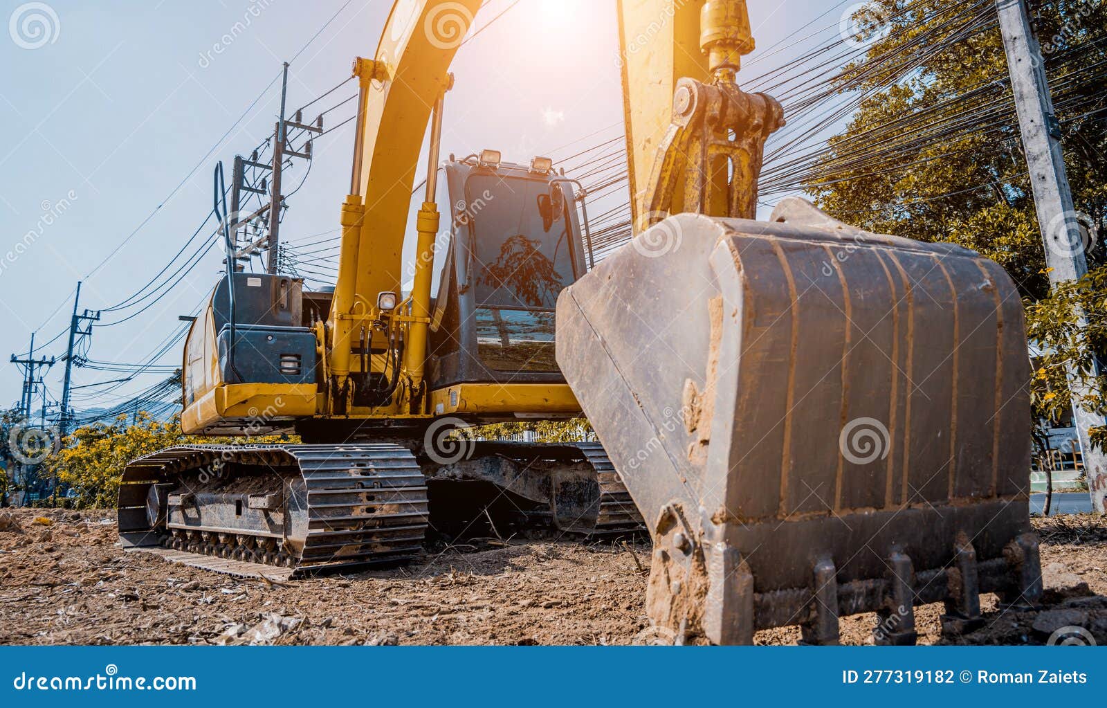Excavator with Shovel Digs the Ground for the Foundation at Constuction ...