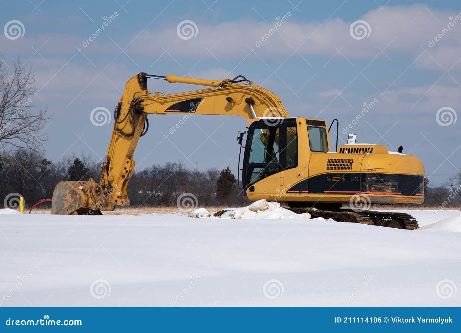 Excavator in the snow stock photo. Image of yellow, hydraulic - 211114106