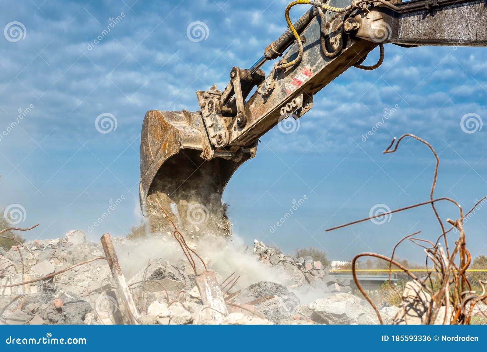An Excavator Spills Soil Out of a Bucket. Stock Photo - Image of ground ...