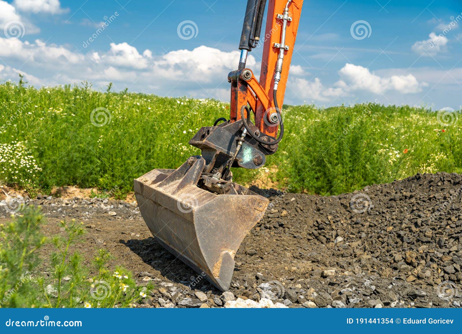 The Excavator Spreads the Ground on the Field Stock Photo - Image of ...