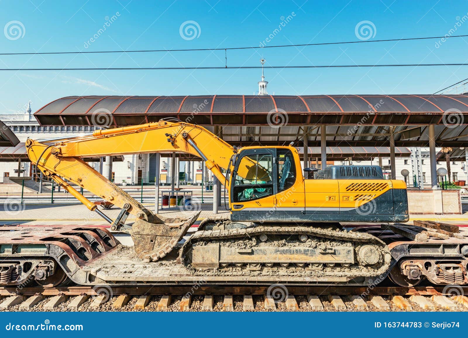 Excavator Stands on the Railway Transporter Stock Image - Image of ...