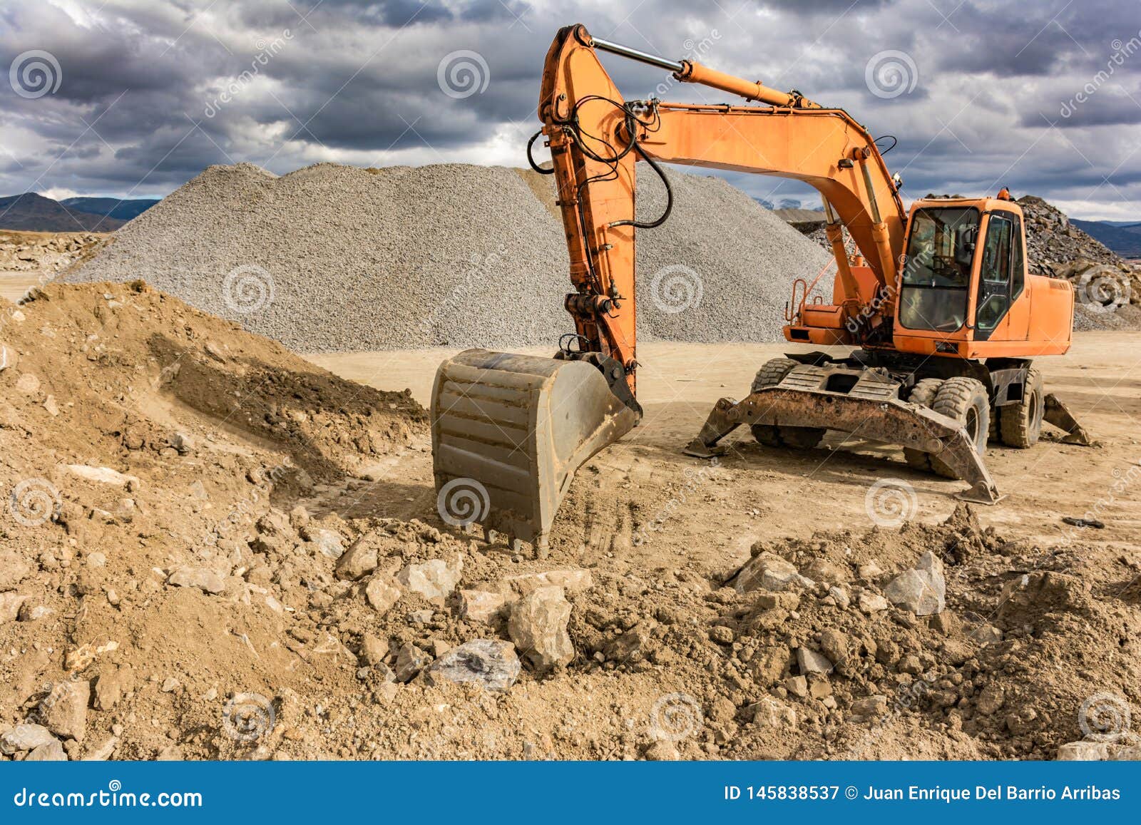 Excavator in a Stone Extraction Mine To Transform into a Gravel Stock ...