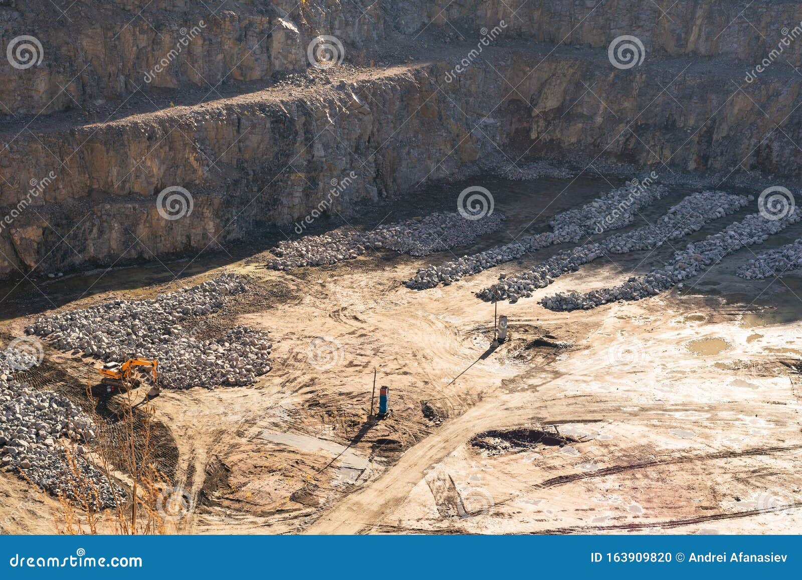 Excavator in a Stone Quarry for the Extraction of Crushed Stone and ...