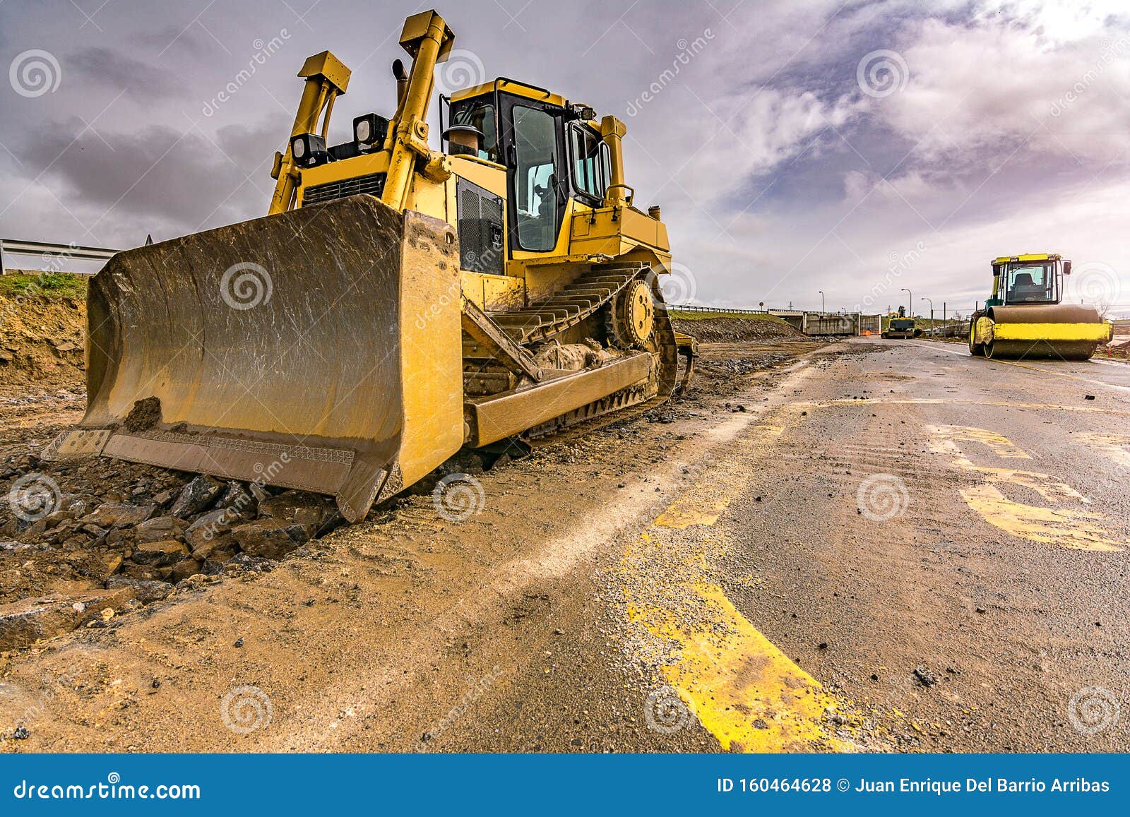 Excavator To Level and Smooth the Land in the Construction of a Road ...