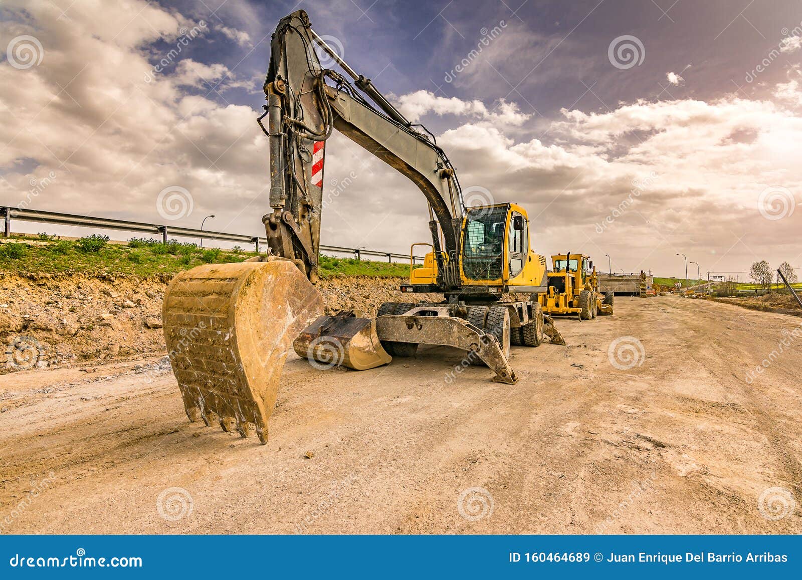 Excavator To Level and Smooth the Land in the Construction of a Road ...