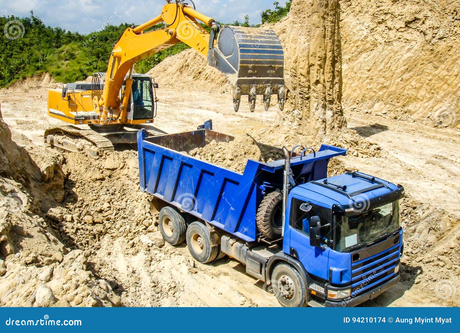 Excavator and Truck in the Road Construction Job, Countryside of ...