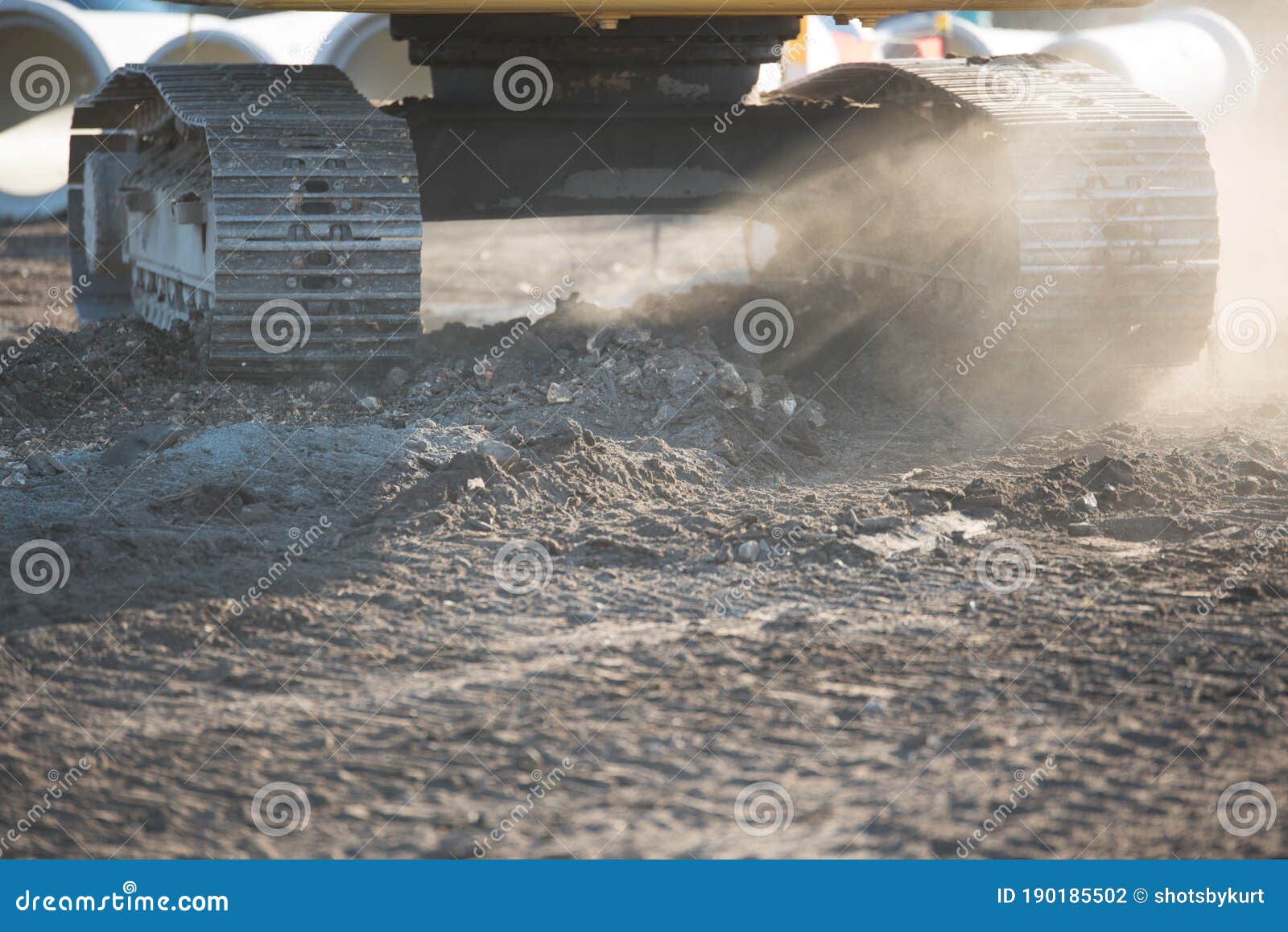 Excavator Tracks Putting Up a Dust Cloud Stock Photo - Image of iron ...