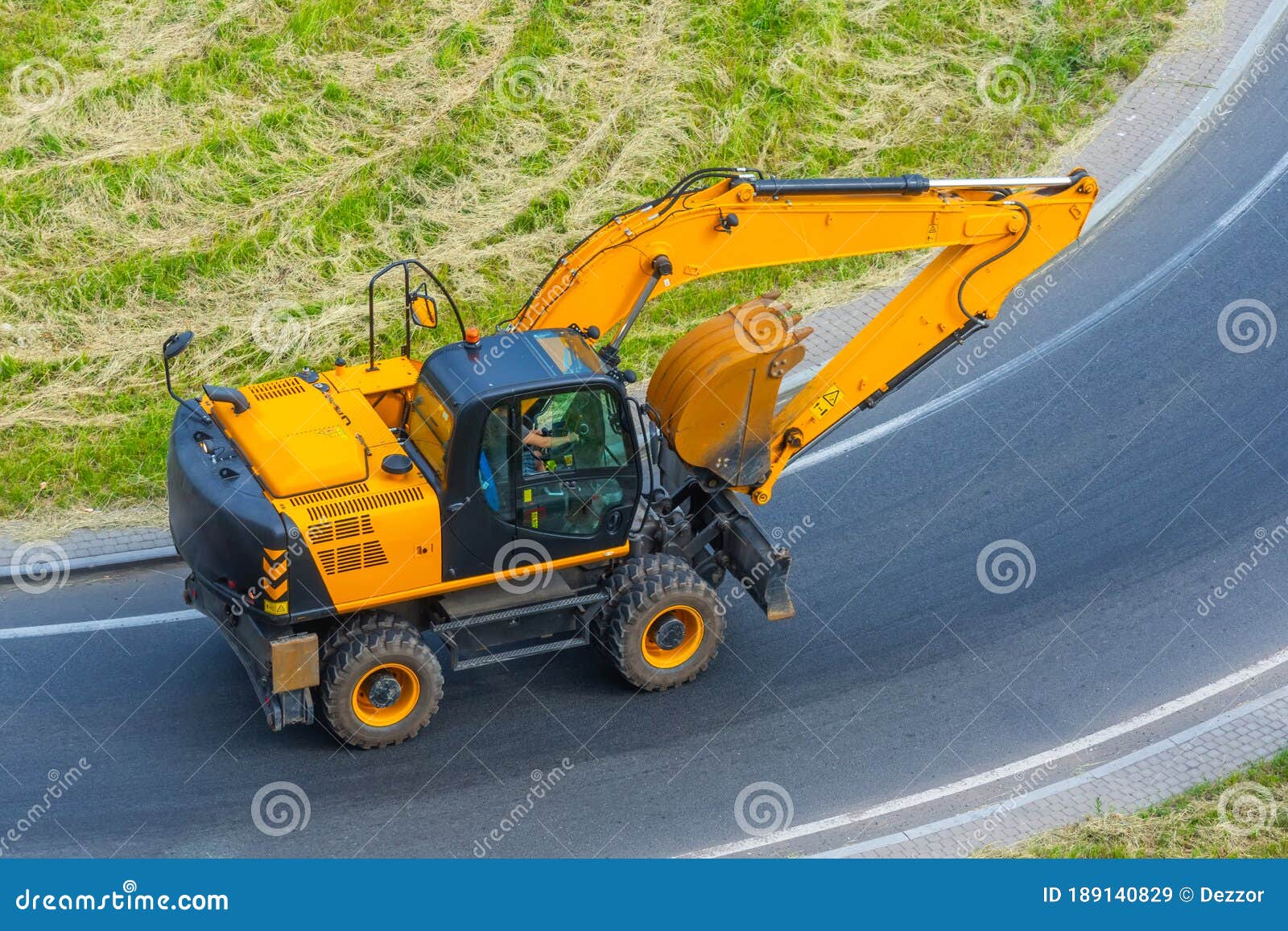 Excavator Travels on the Road To Turning Stock Image - Image of loader ...