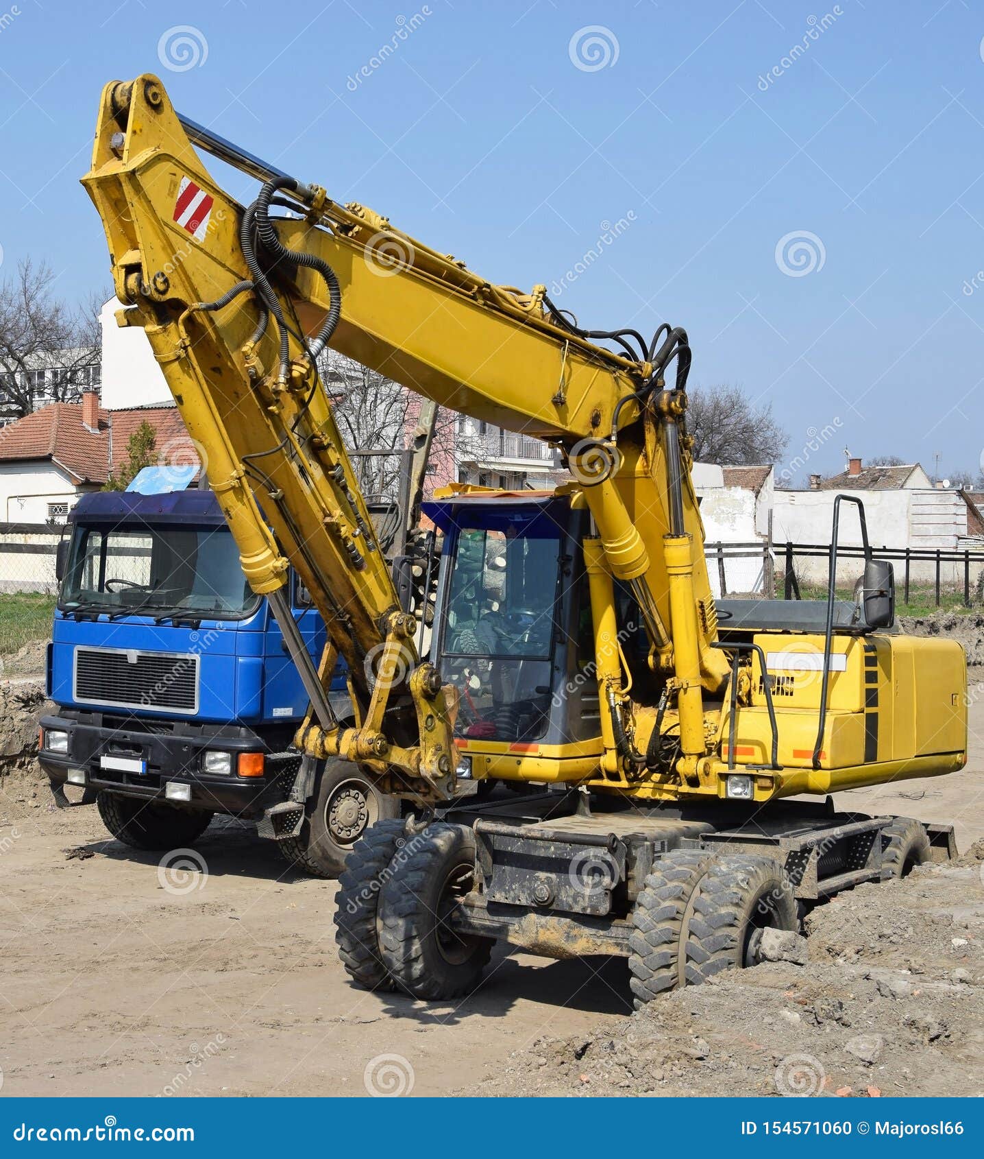 Excavator and Truck at the Road Construction Site Stock Photo - Image ...