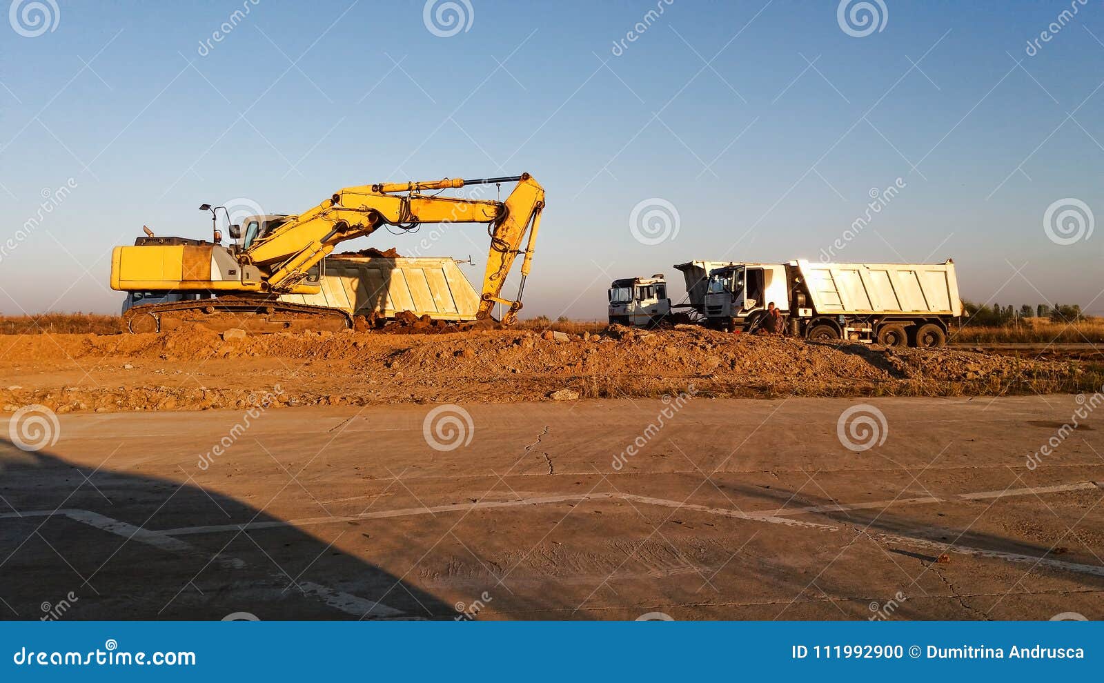 Excavator and trucks stock photo. Image of earth, industrial - 111992900