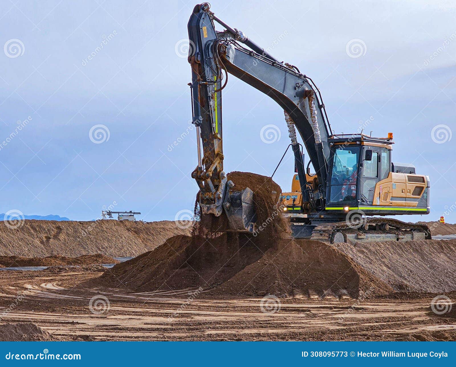 Excavator Type Construction Machinery Working on Bulk Earthworks in a ...