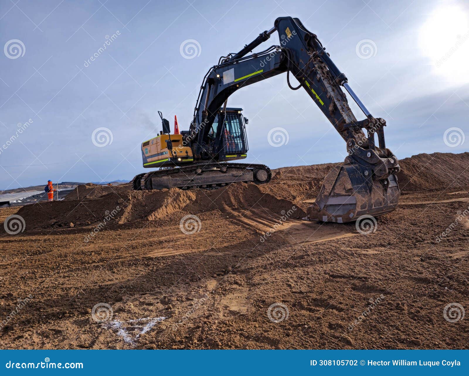 Excavator Type Construction Machinery Working on Bulk Earthworks in a ...