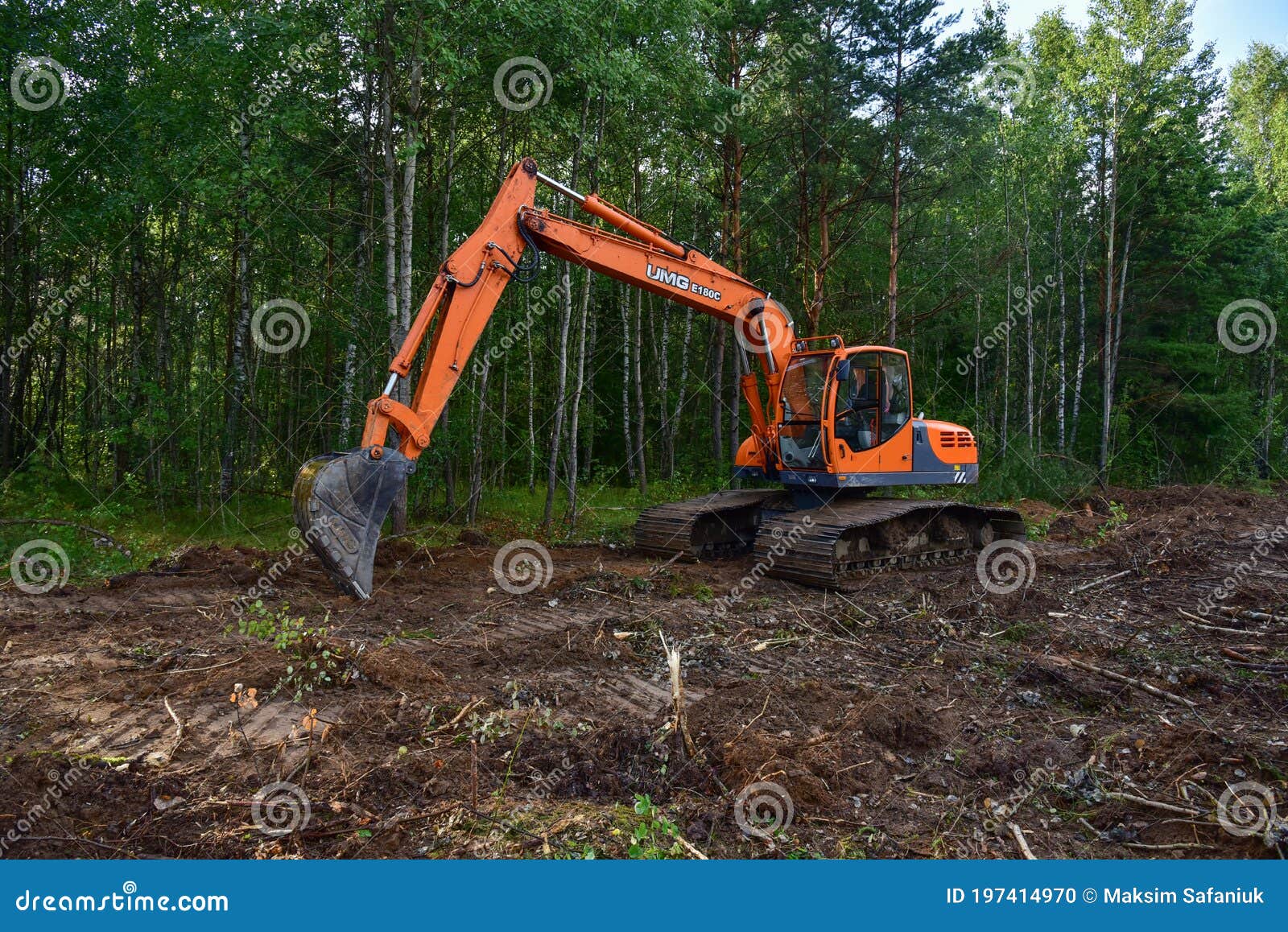Excavator UMG E180C Clearing Forest for New Development. Orange Backhoe ...