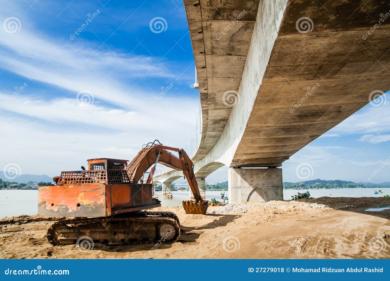 Excavator under a Bridge stock photo. Image of excavate - 27279018