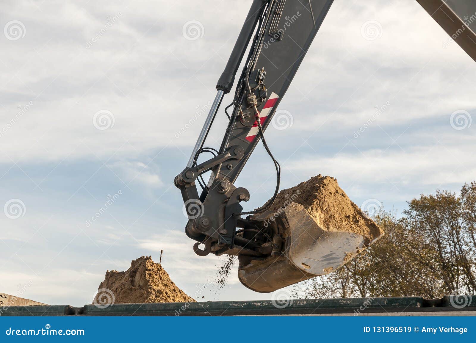 Excavator unloads his sand stock image. Image of history - 131396519