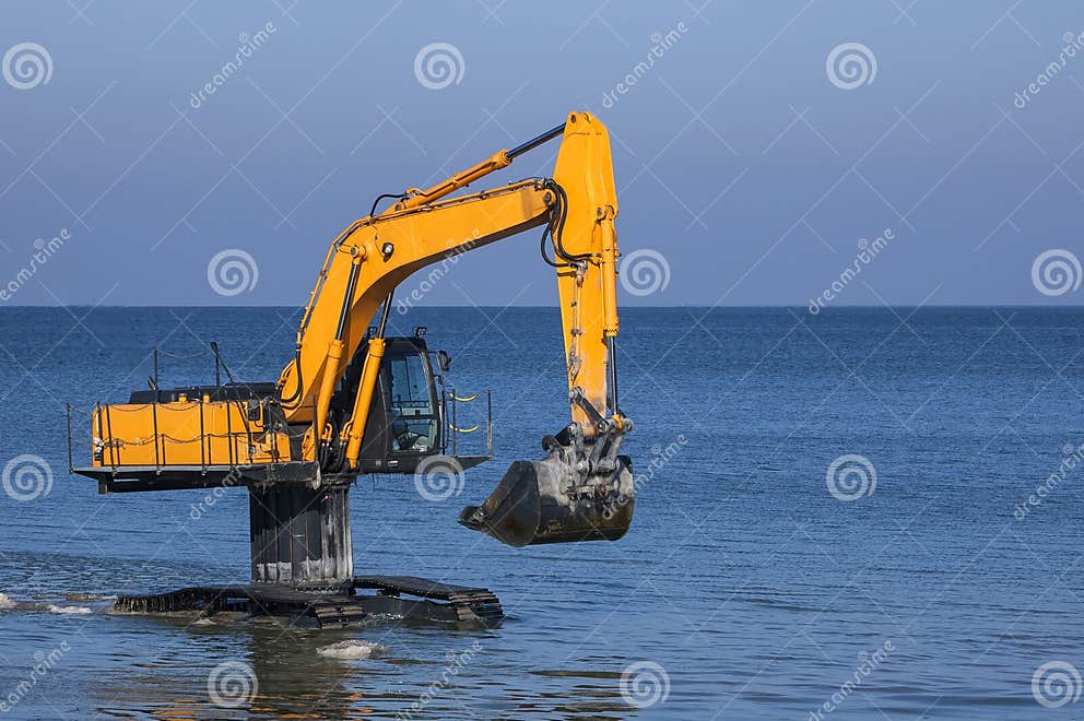 EXCAVATOR in WATER stock image. Image of excavator, coast - 74091383