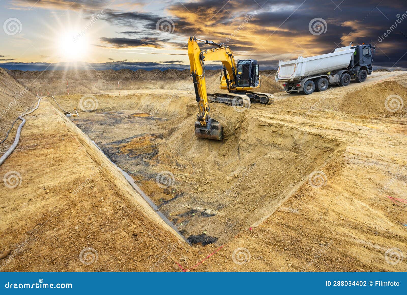 Excavator is in Work and Digging at Construction Site. Stock Photo ...