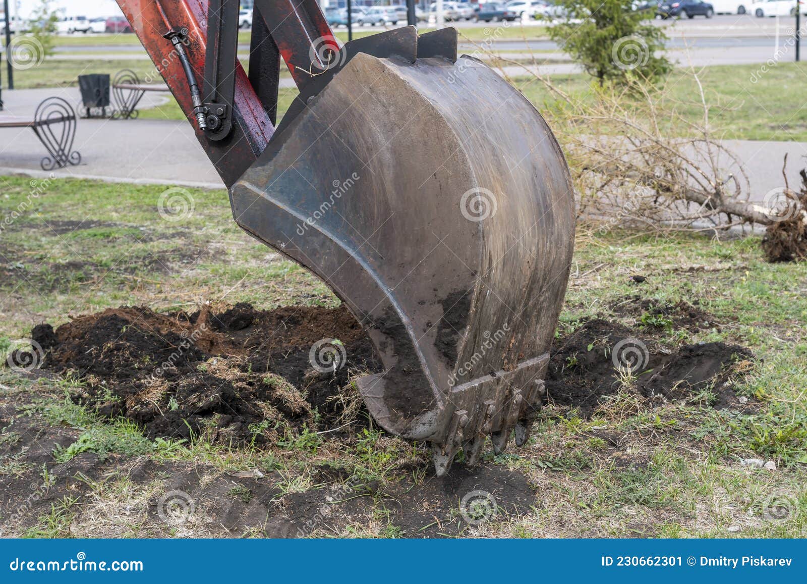 Excavator Work. the Iron Ladle Digs into the Ground. Digging a Hole ...