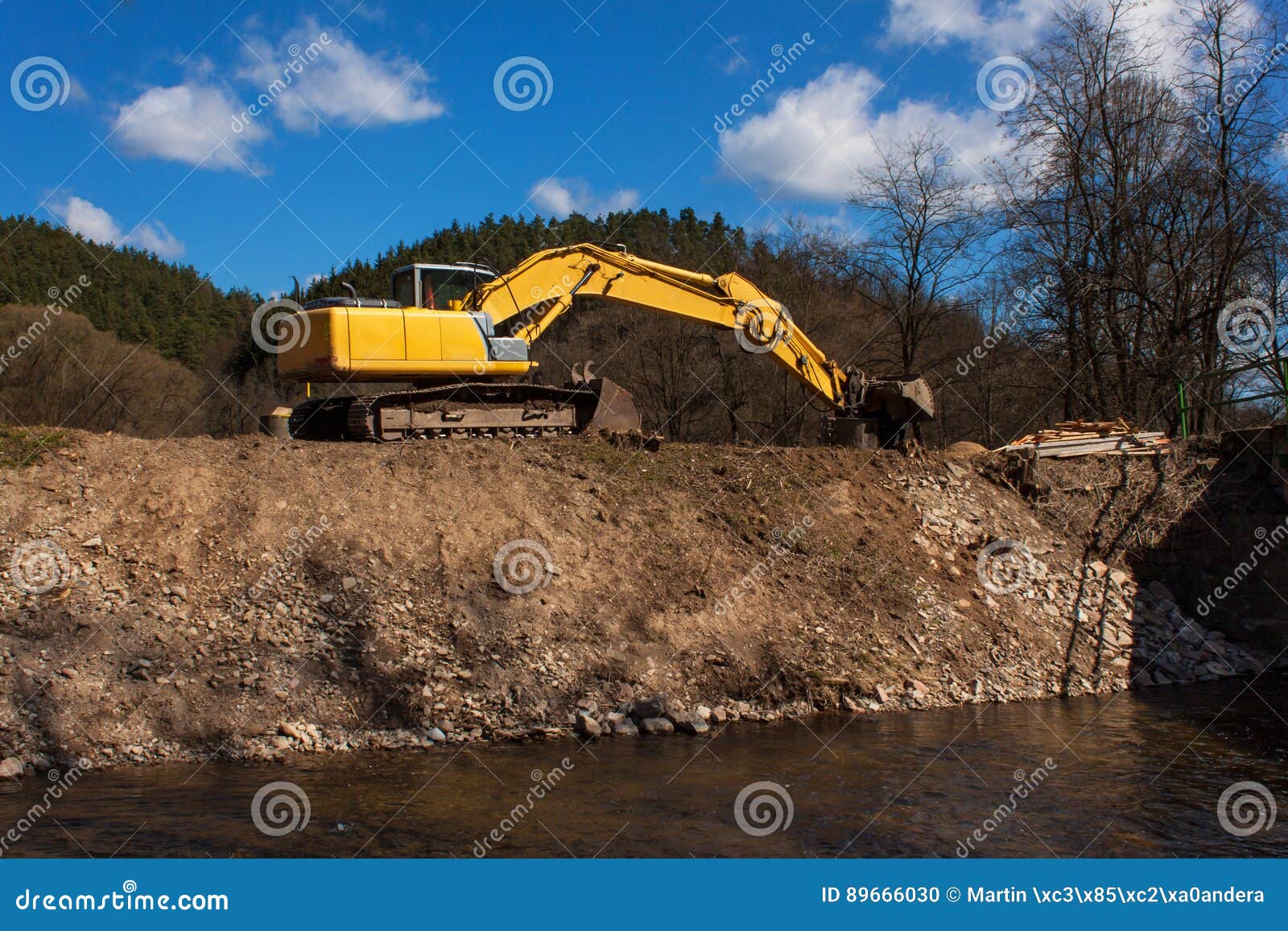 Excavator on the Work To Strengthen the Shoreline of the River. Stock ...