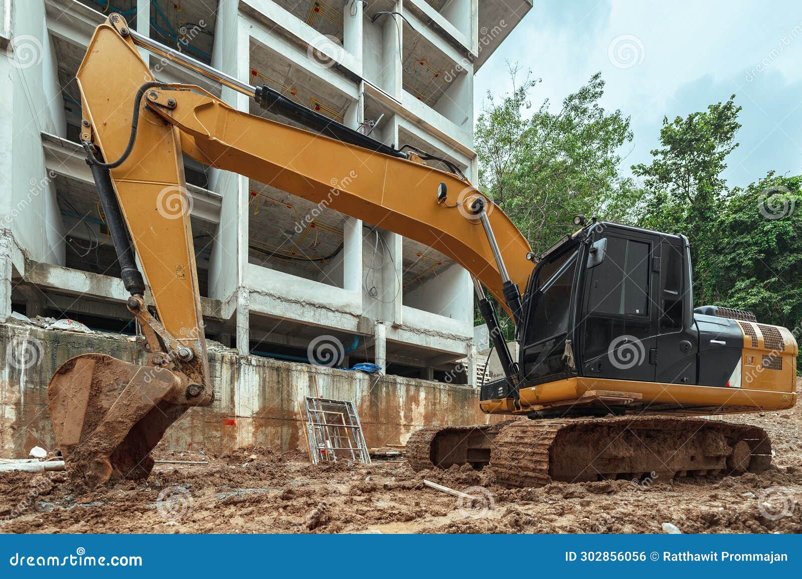 Excavator Working at Construction Site, Backhoe on Building Site Stock ...