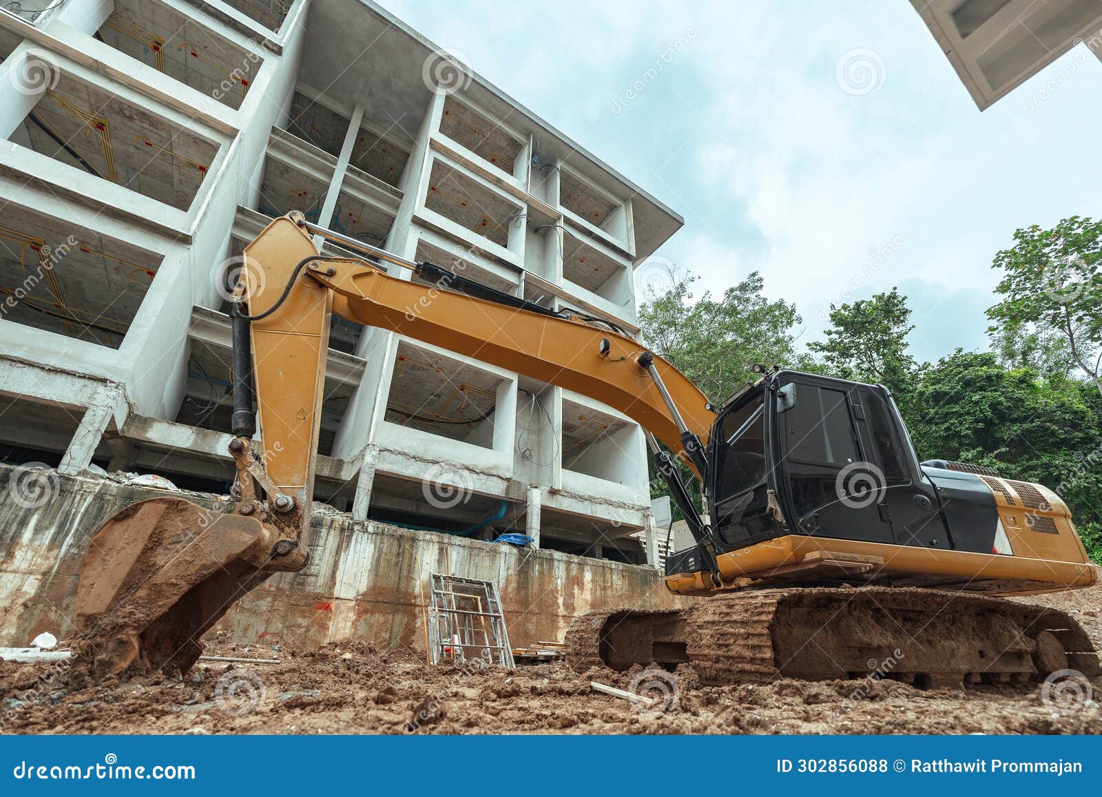 Excavator Working at Construction Site, Backhoe on Building Site Stock ...