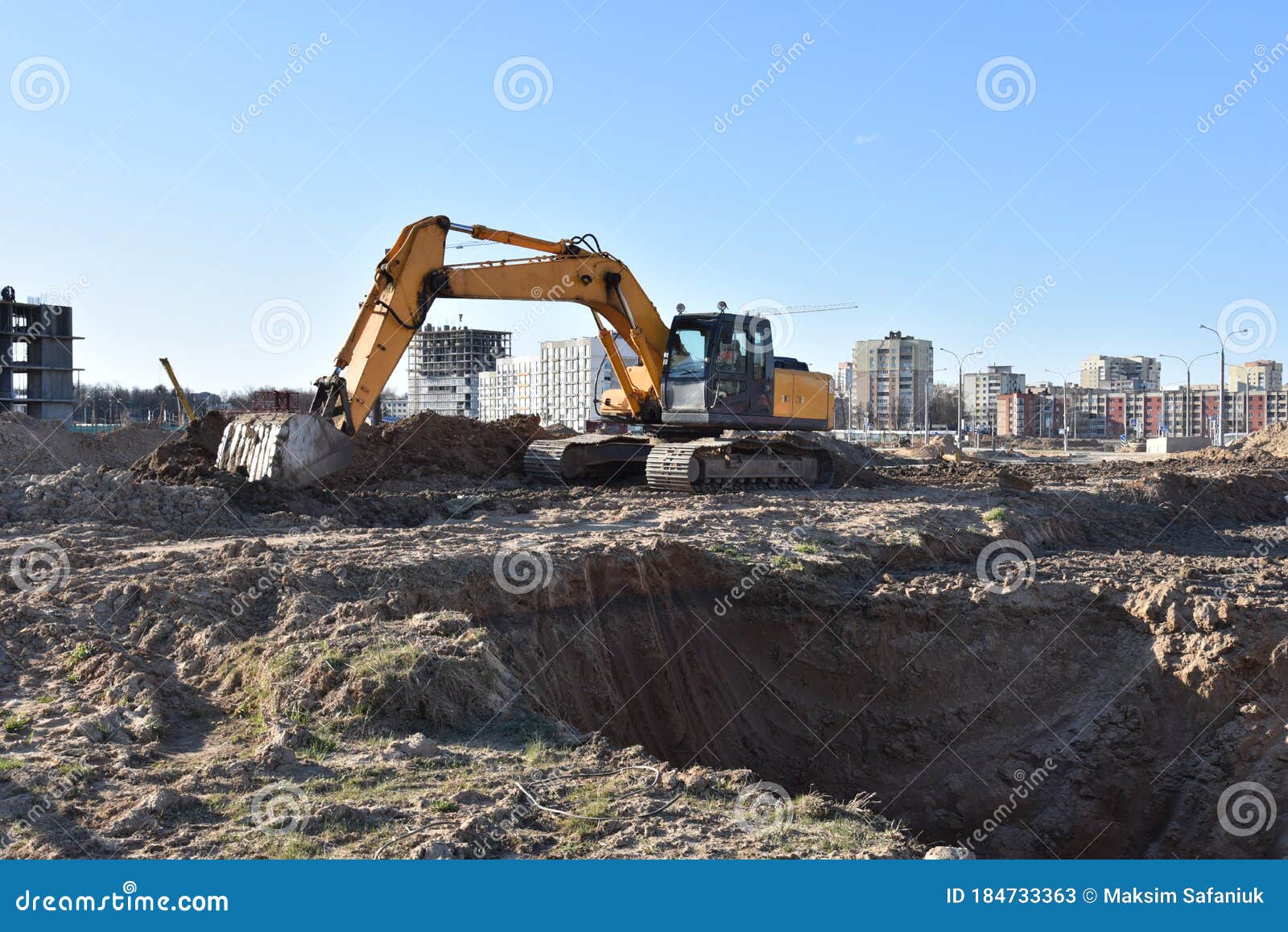 Excavator Working at Construction Site on Earthworks. Backhoe Digging ...