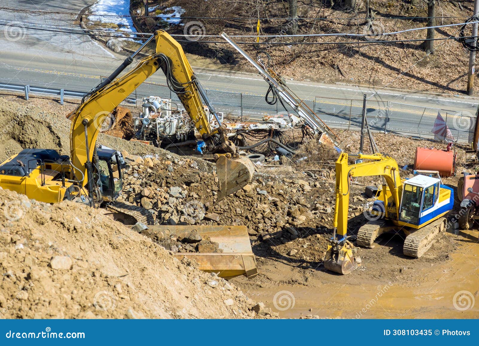 An Excavator Working on Earthwork at a Industrial Site Under ...