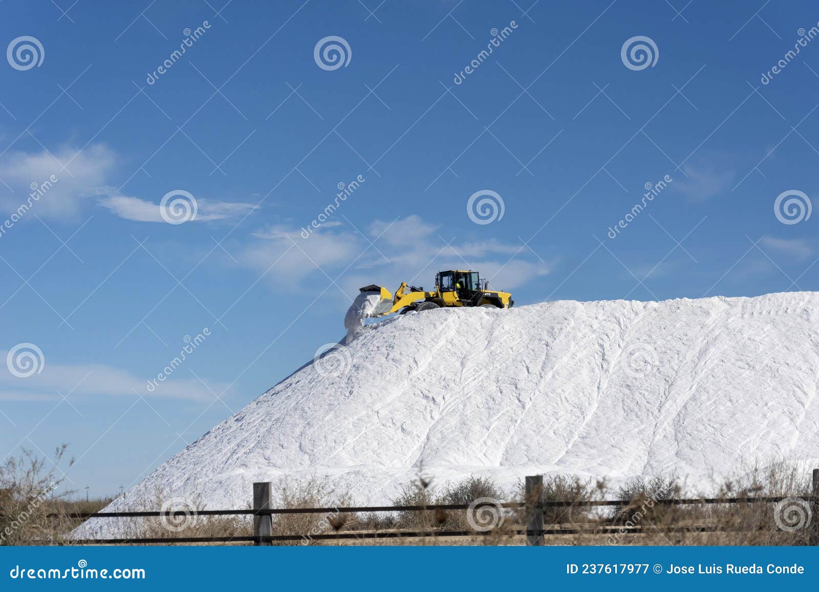Excavator Working on Top of a Huge Pile of Salt in the Salt Flats ...