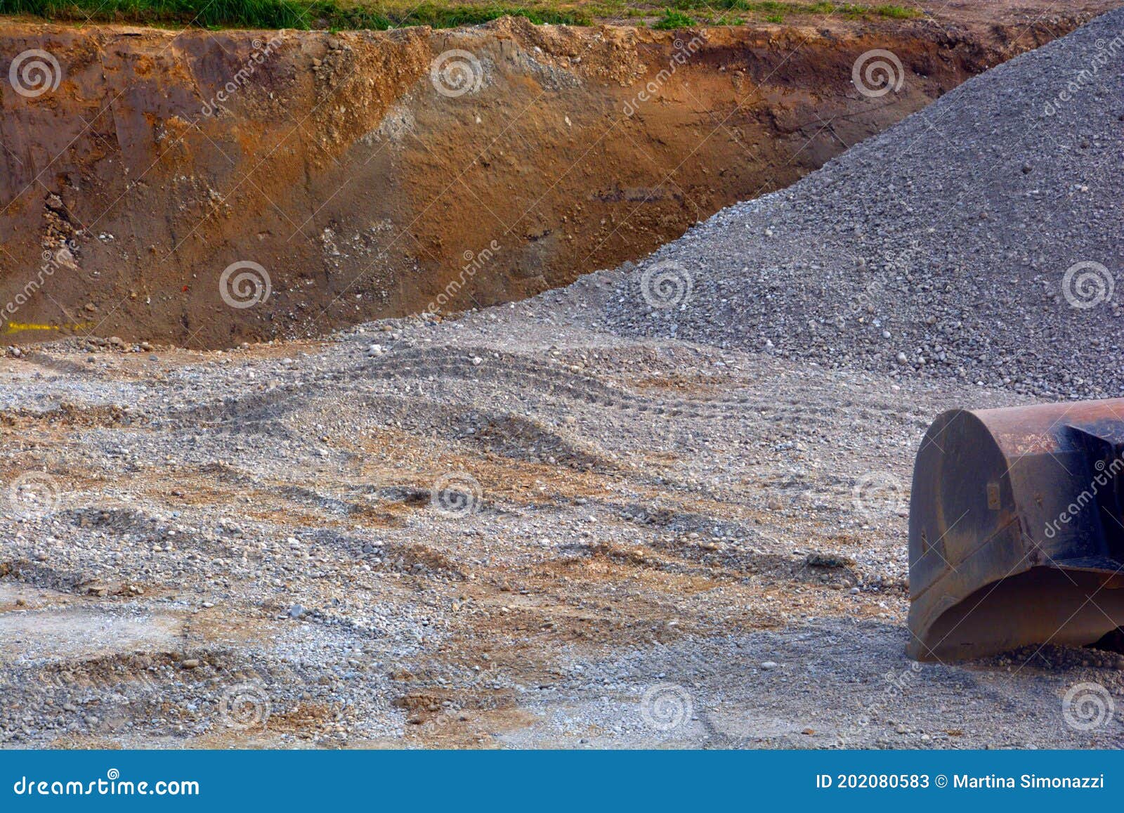 An Excavator Working Removing Gravel and Sand on a Construction Stock ...