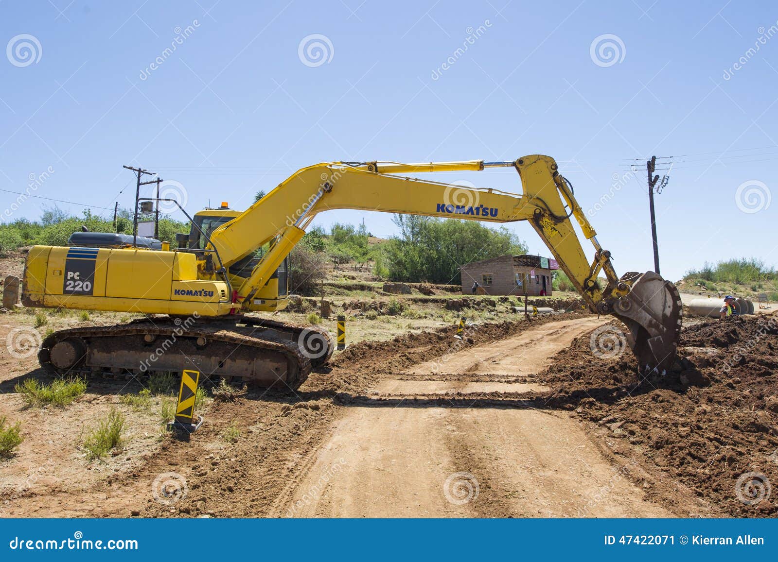 Excavator Working At Construction Site. Backhoe During Earthworks ...