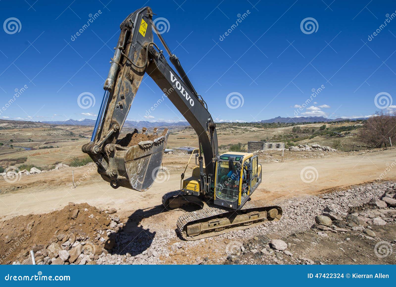 Excavator working on road. editorial stock image. Image of epic - 47422324