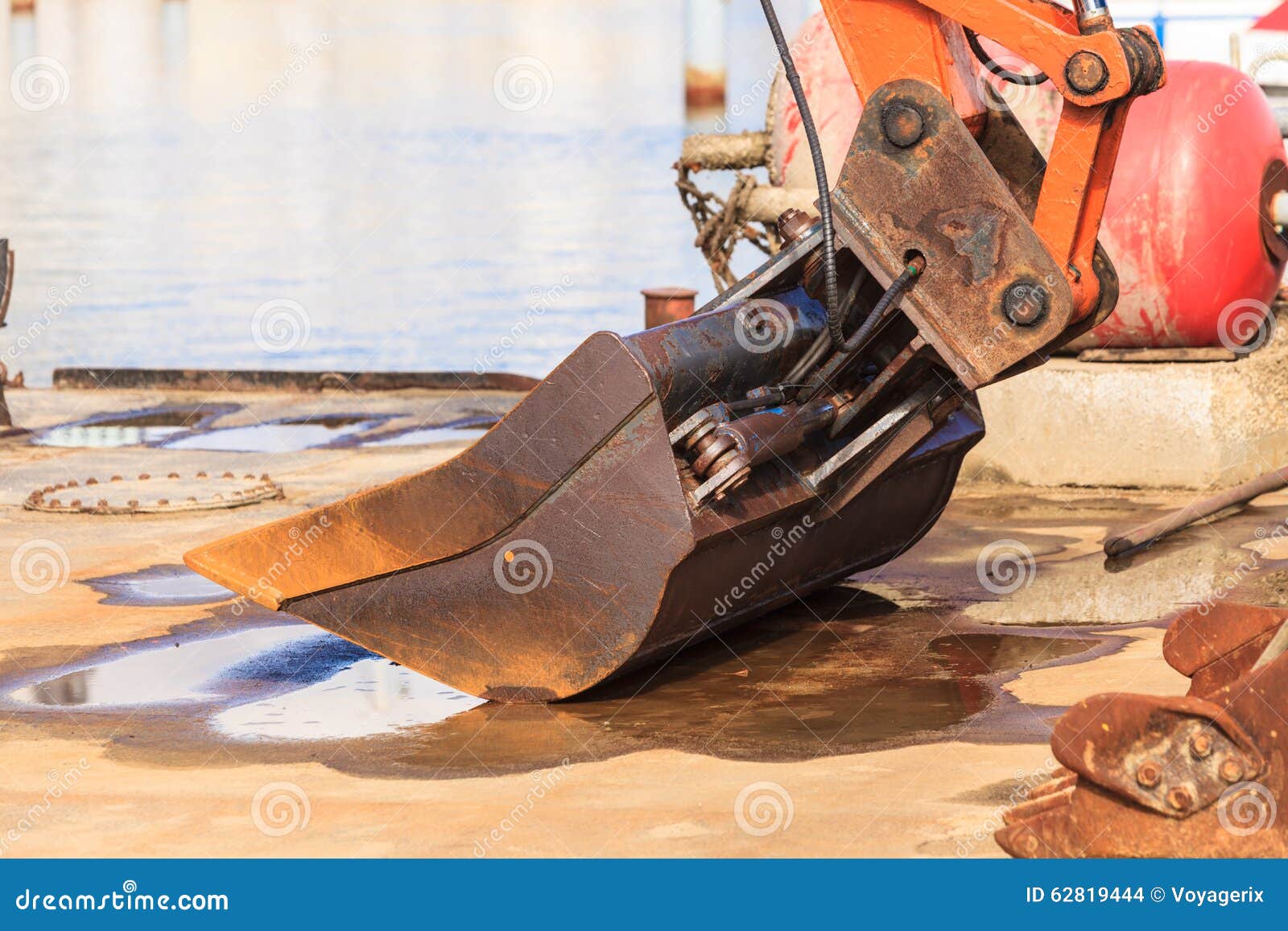 Excavator working at sea. stock photo. Image of heavy - 62819444