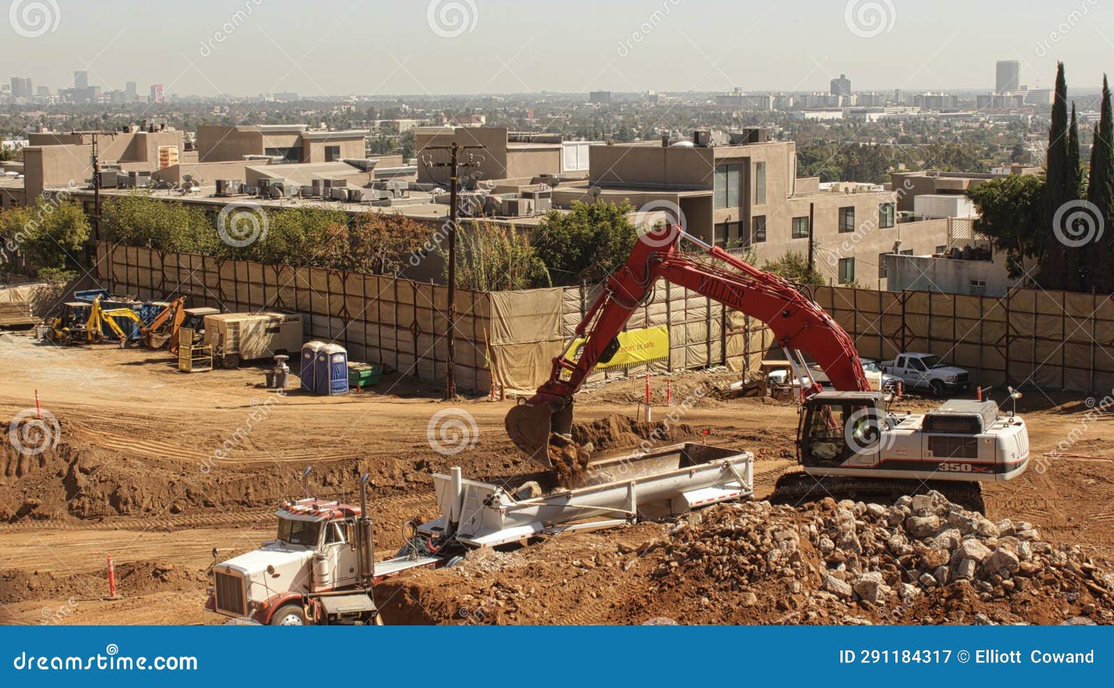 Excavator Working To Remove Debris in Construction Site Pit Editorial ...