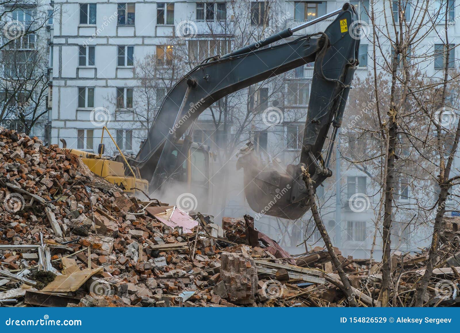 Excavator Working on the Wreckage of the Building Stock Image - Image ...