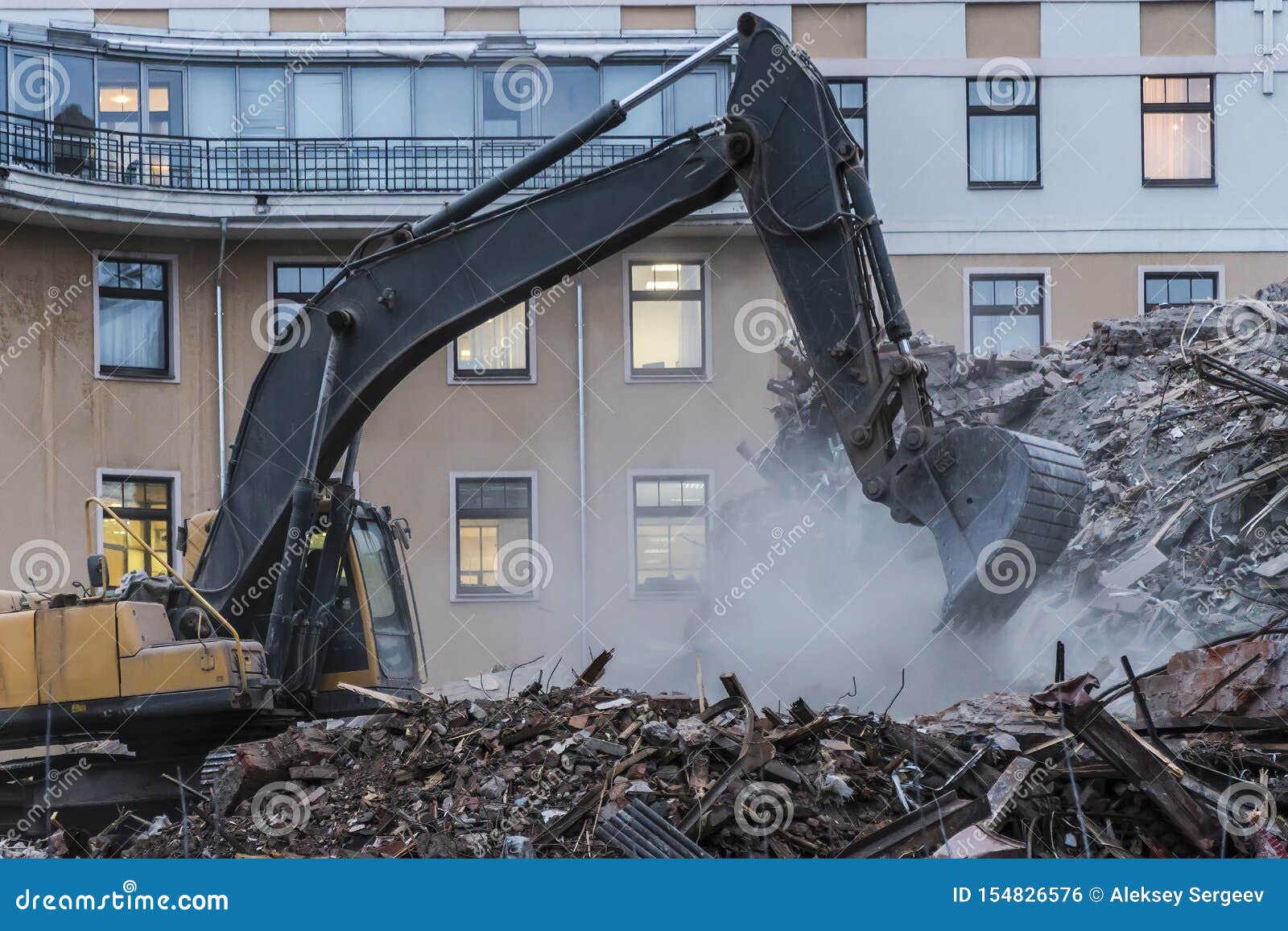 Excavator Working on the Wreckage of the Building Stock Photo - Image ...