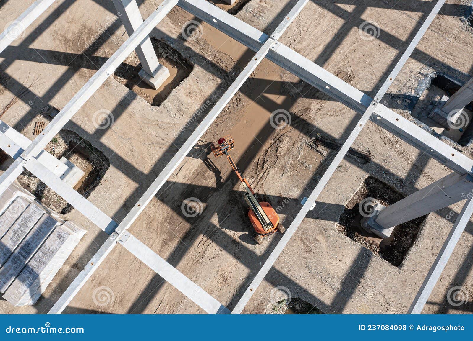 Excavator Working on a Yard for the Construction Industry. Stock Photo ...