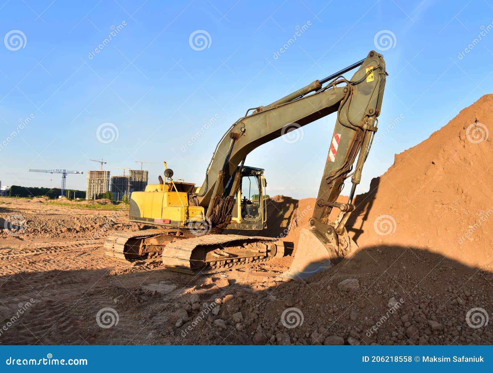 Excavator Works on a Construction Site during Excavation Work Against a ...