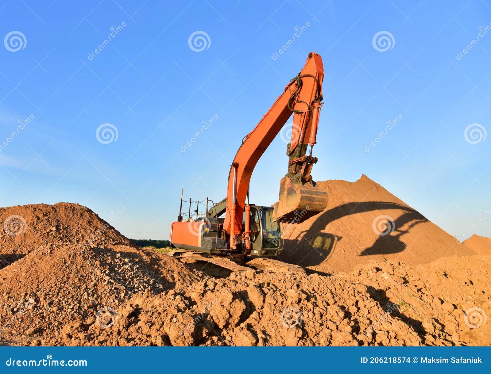 Excavator Works on a Construction Site during Excavation Work Against a ...