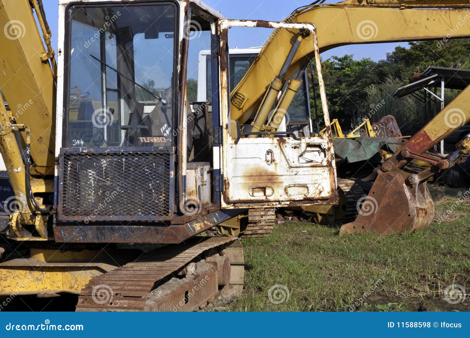 Used Excavators, Heavy Scrap Stock Photo - Image of grass, outside ...