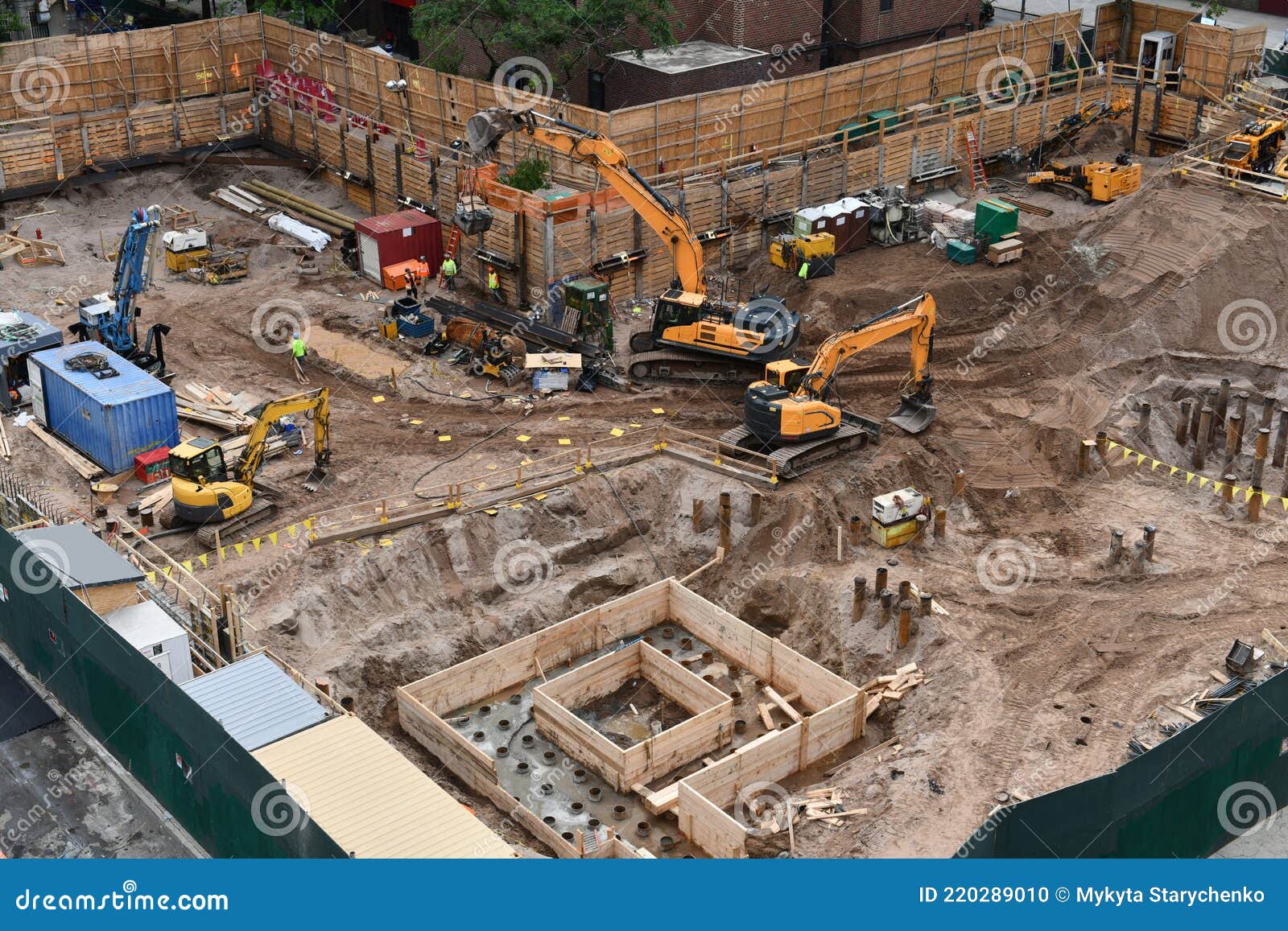Excavators Digging on Skyscraper Construction Site with Foundation Pit ...