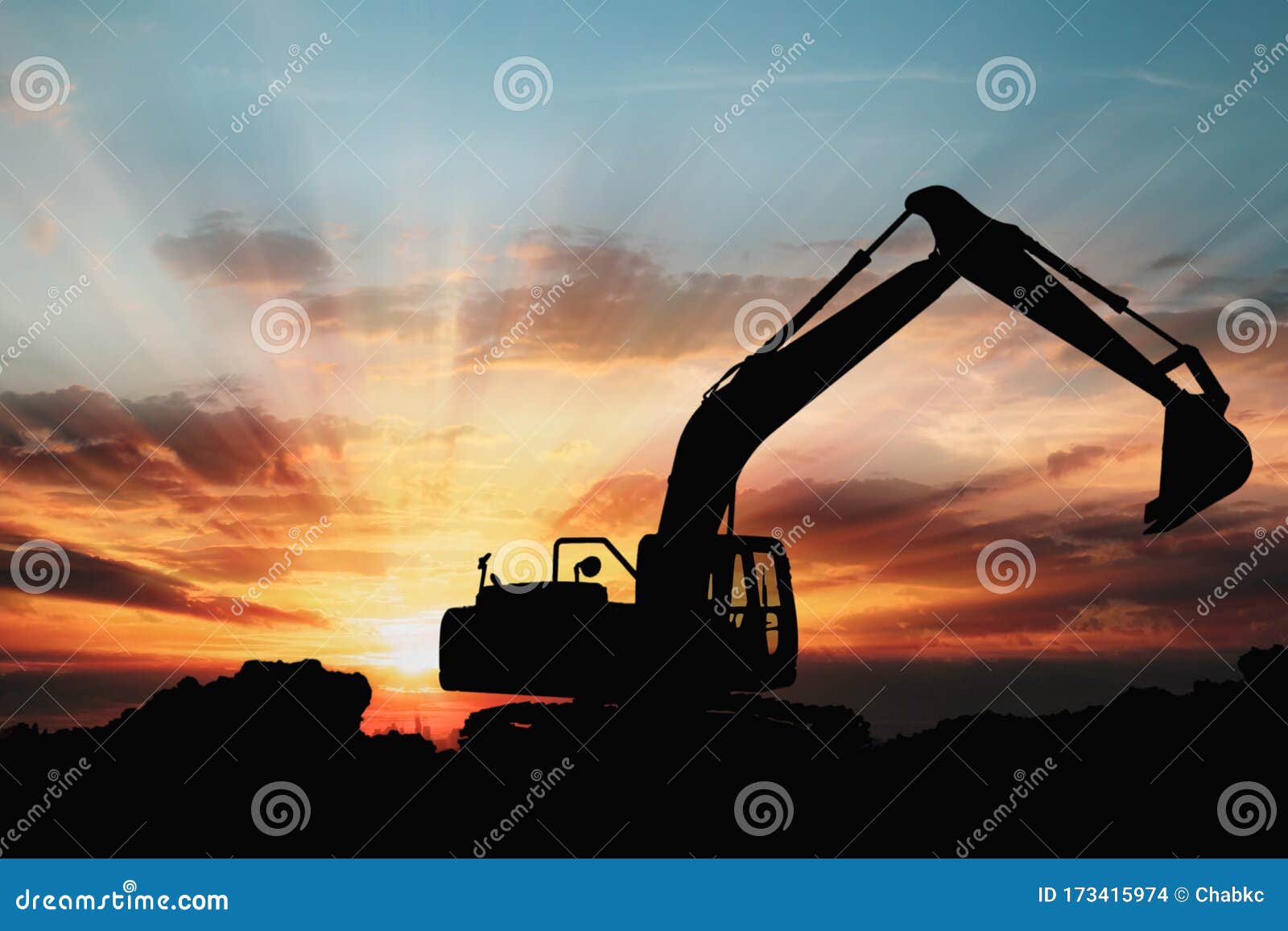Excavators are Digging the Soil in the Construction Site on the Sunset ...