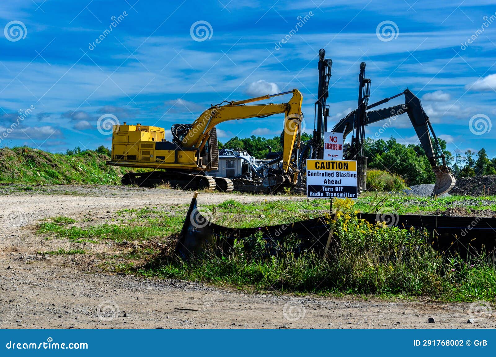 Excavators and Drilling Machines at a Construction Site Stock Photo ...
