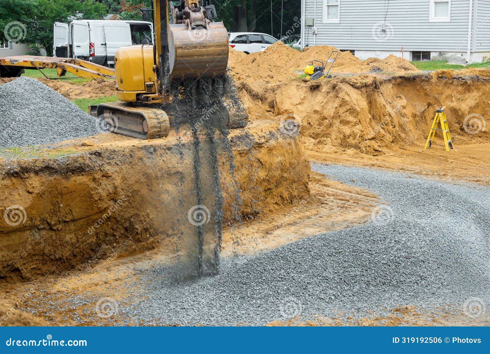 Excavators Fill Irregularities in Excavations with Granite Rubble Bases ...